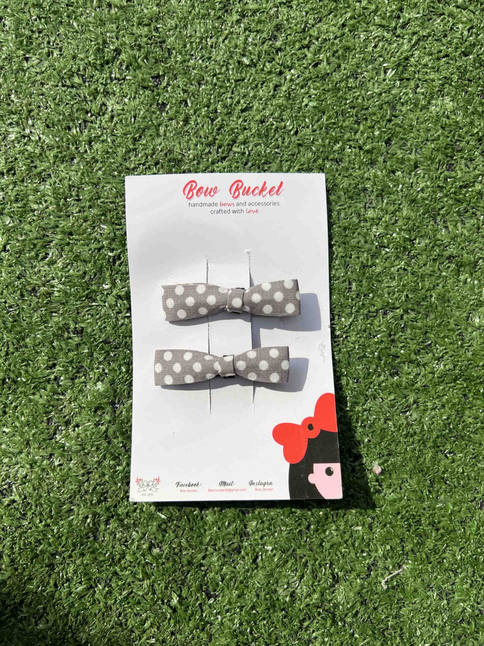 grey polka pair clip