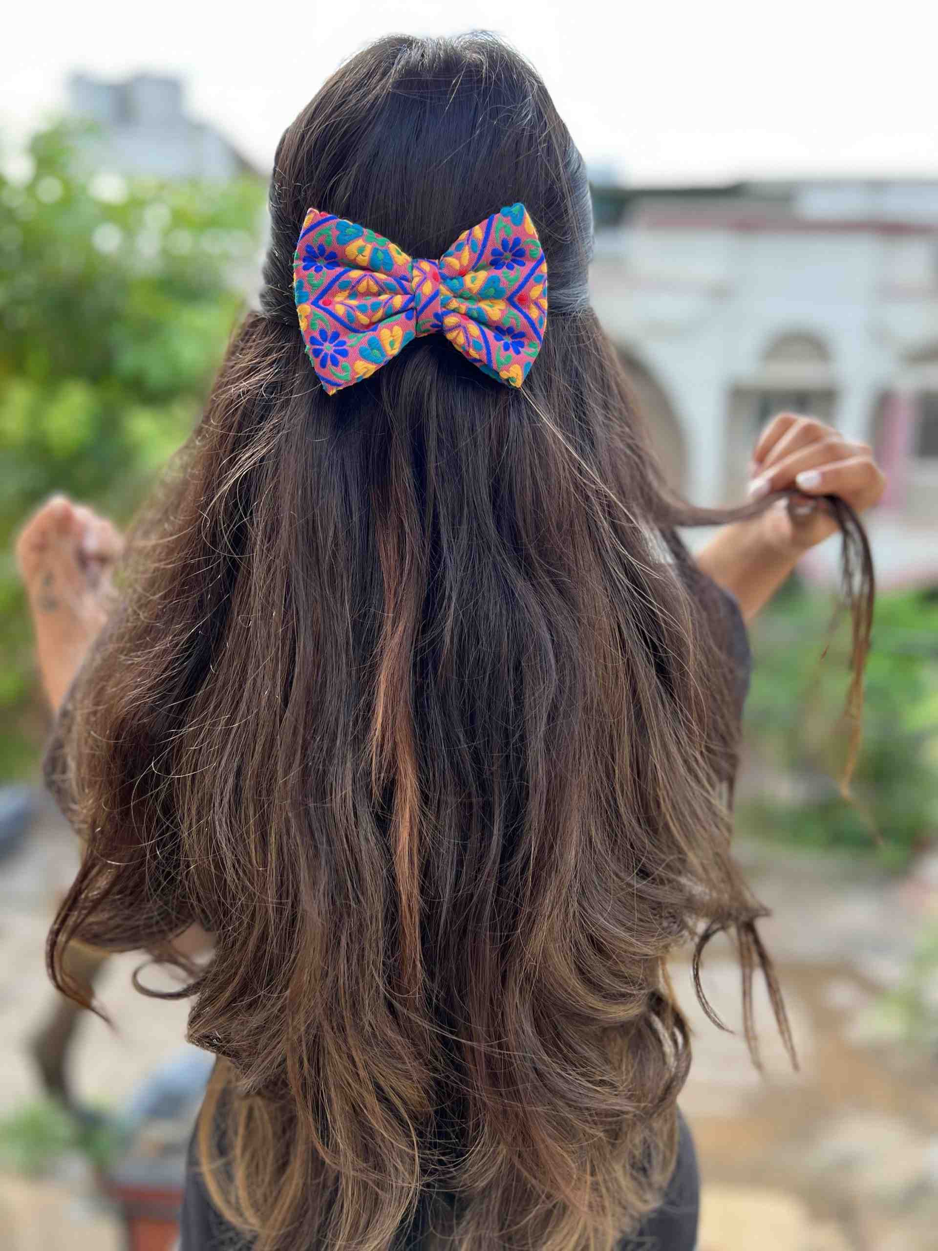 Purple thread work traditional bow